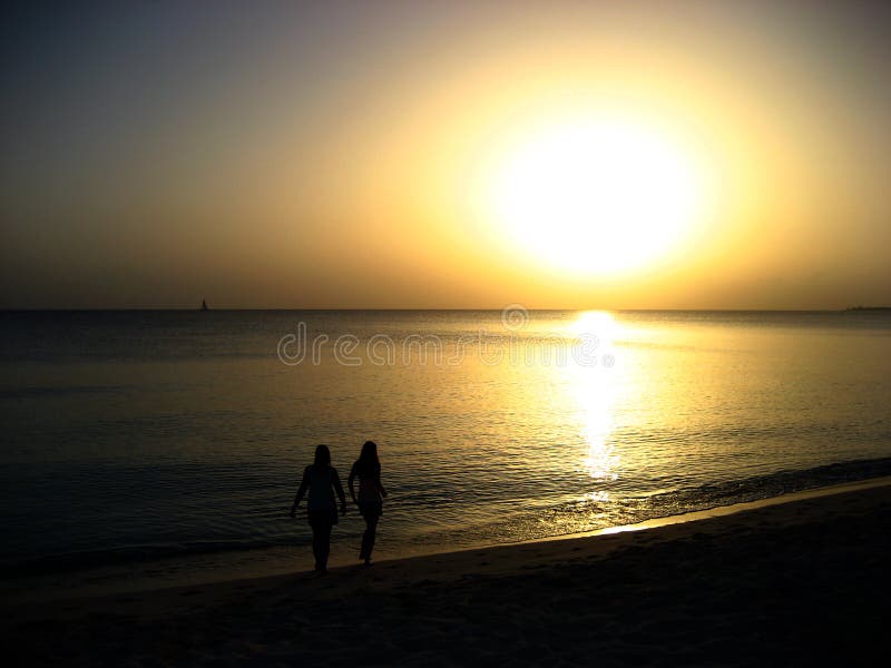 Walking into the Sunset stock photo. Image of teens, ocean - 1569214