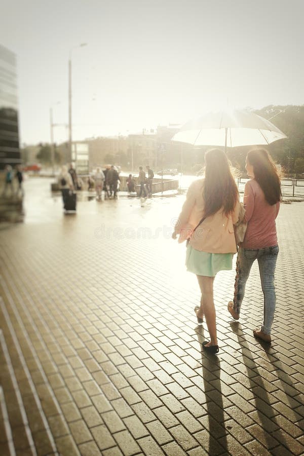 Walking on the Sunset Under the Rain with Umbrella Editorial Photo ...