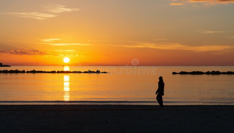 Walking at sunset stock photo. Image of water, night - 82876426