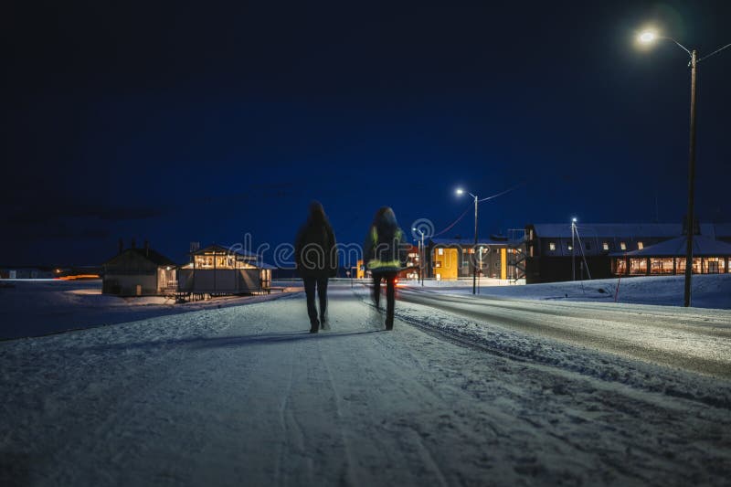 Walking Under Streetlights: Arctic Winter Polar Night Scene Stock Image ...