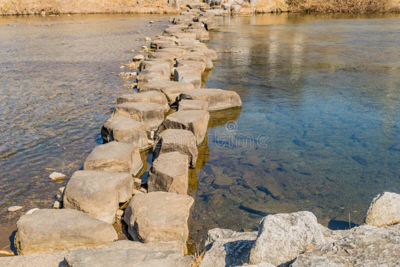 Walkway Across River Made of Large Boulders Stock Image - Image of fish ...