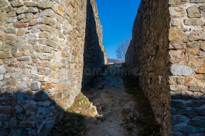 Walkway in the Ground between High Stone Walls. Stock Photo - Image of ...