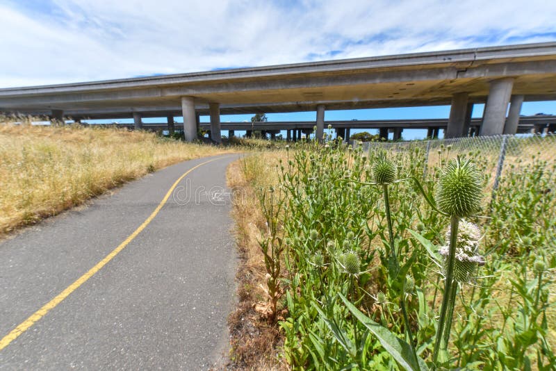 Walkway Next To a Freeway with Fence Stock Image - Image of walkway ...