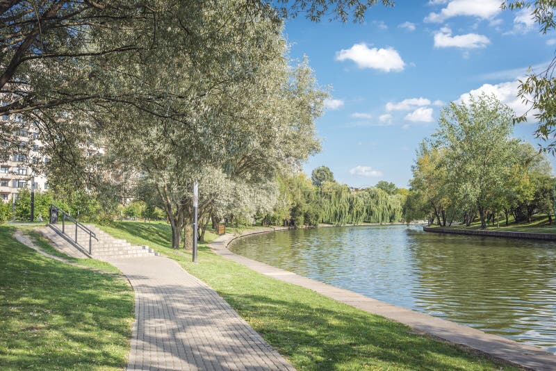 Walkway in the Park Along the River. Beautiful Landscape of Summer ...