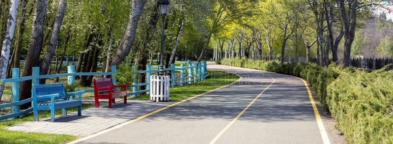Walkway through the Park, Benches for Relaxation. Beautiful Spring ...