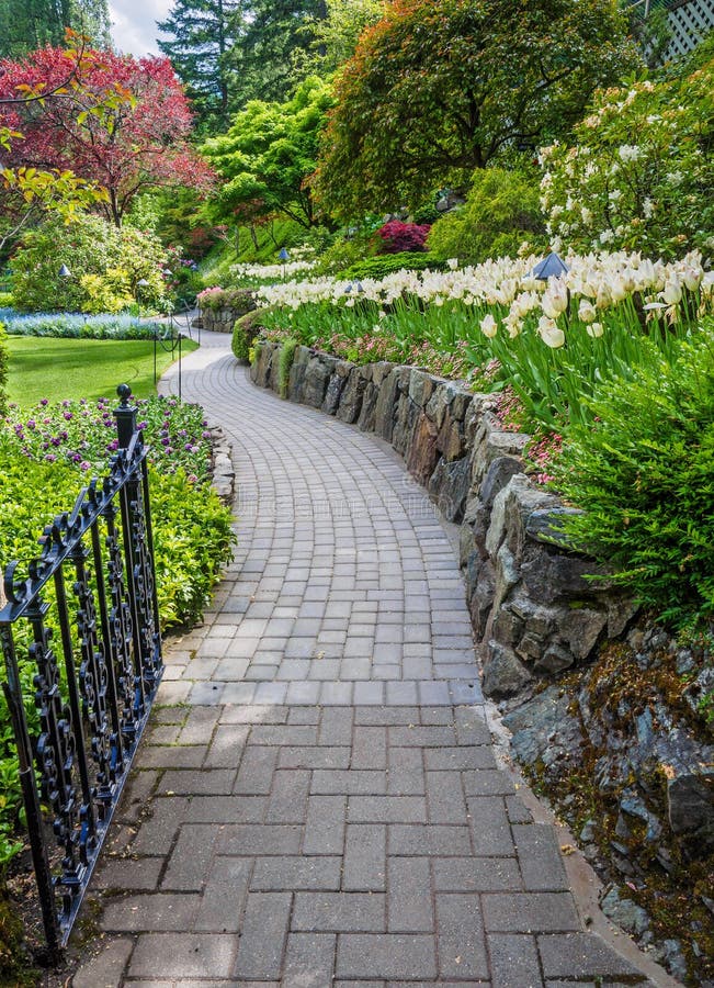 Walkway in a spring garden stock photo. Image of green - 66053918