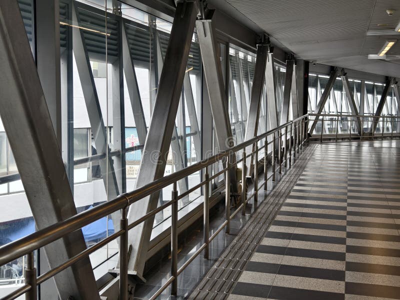 A Walkway with a Sturdy Metal Railing and Checkered Floor Design Stock ...