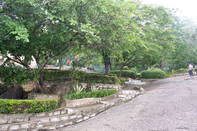 Walkway Surrounded by Decorative Structures Holding Abundant Greenery ...