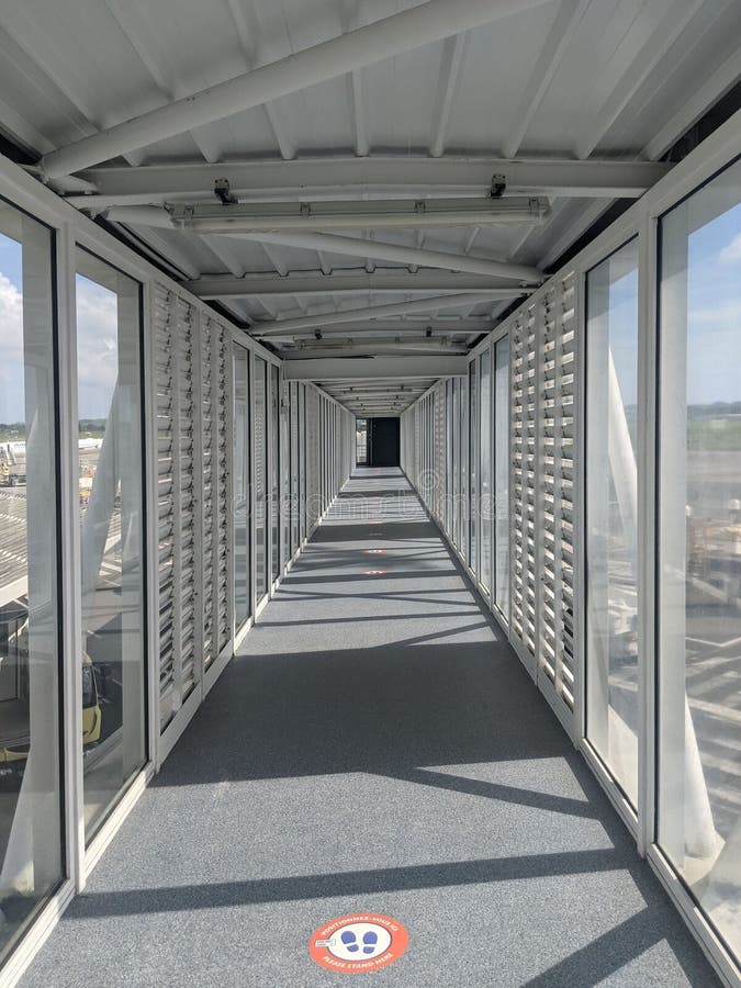 Walkway To an Airplane. Inside of an Empty Bridge with Signs of Social ...