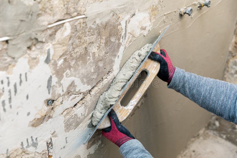 Wall Alignment - Construction Worker Working with Trowel and Plaster ...