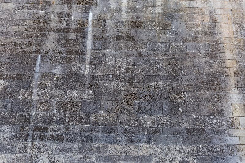 Wall of Ancient Castle Bastion Clad with Stone Blocks, Fragment Stock ...