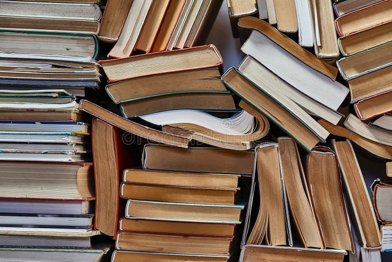 Books Piled Up Stock Photos - Download 300 Royalty Free Photos