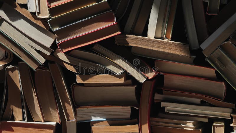Wall of books piled up stock footage. Video of antique - 164370076
