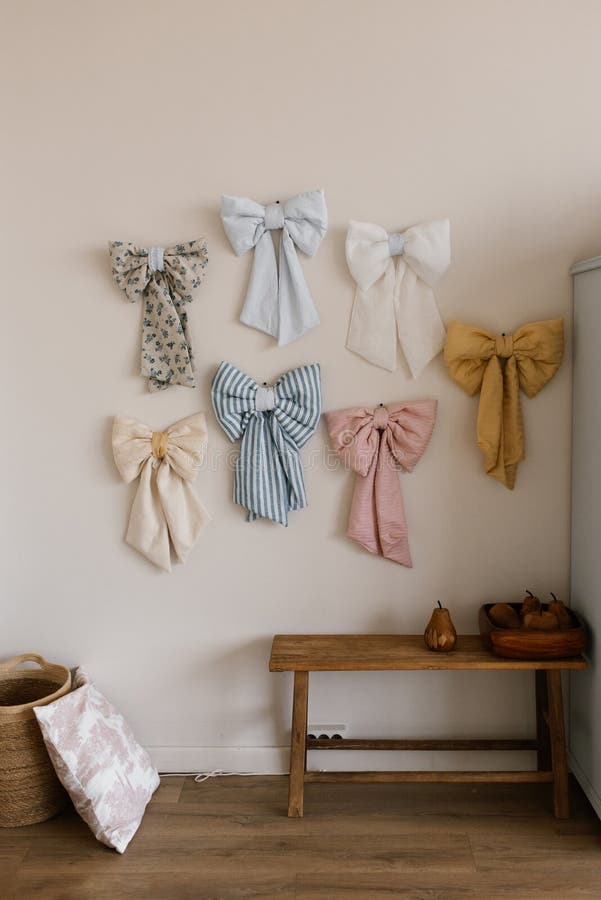 Wall of Bows Hanging from the Wall, with a Wooden Bench in Front of it ...
