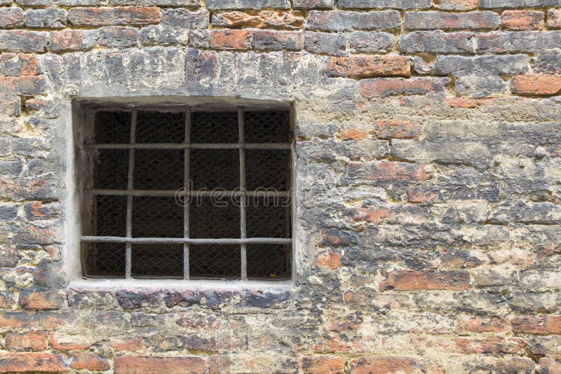 Wall of brick with grate stock photo. Image of ancient - 42039050