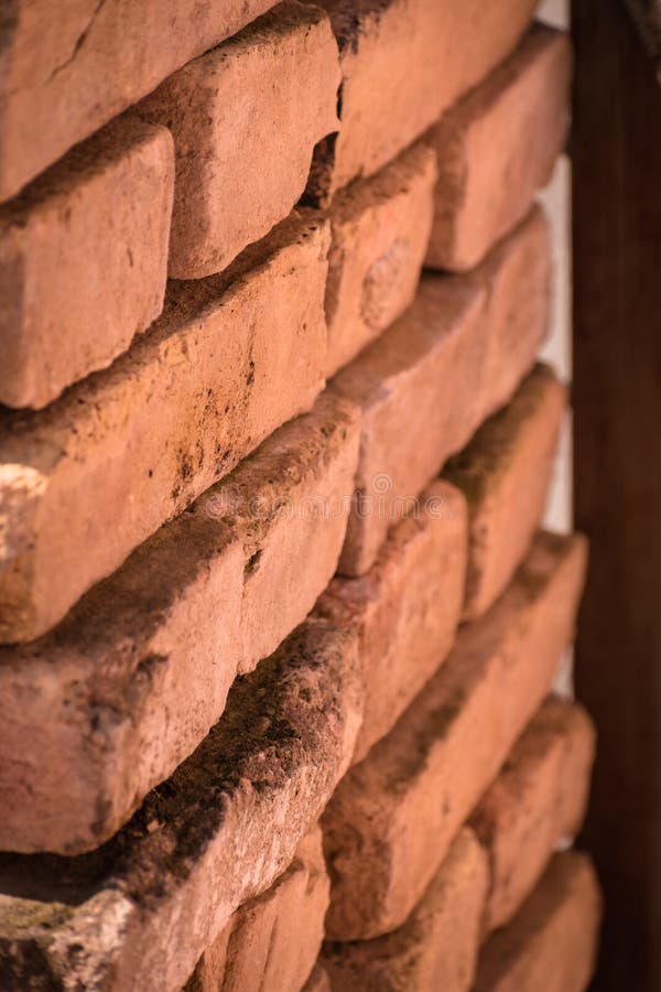 Wall of bricks piled up stock photo. Image of brown - 217469146