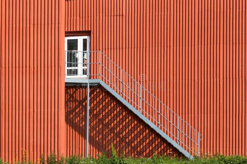 Wall of the Building is Red with a Ladder in Its Middle Stock Photo ...