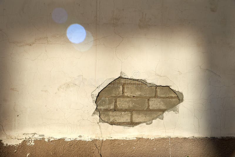 The Wall Caved in, the Plaster and the Bricks are Visible. Stock Image ...
