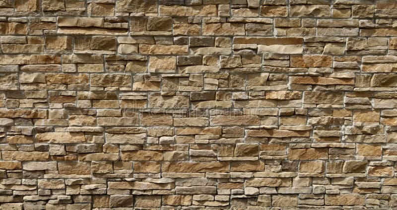 Wall Cladding in Brown Natural Stone Made from Bricks of Irregular ...