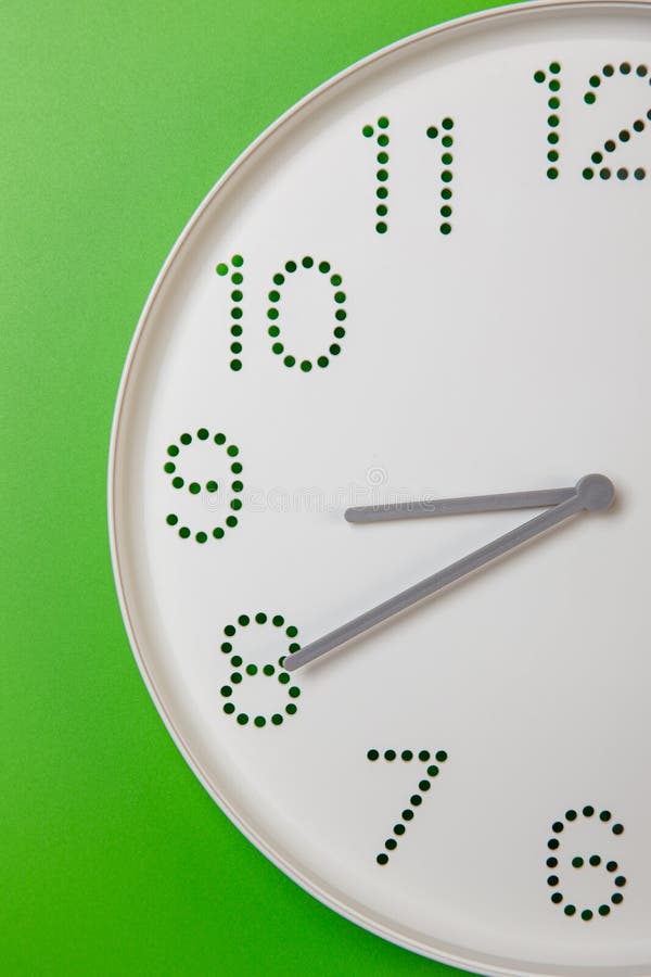 A White Wall Clock on Green Background Stock Image - Image of round ...