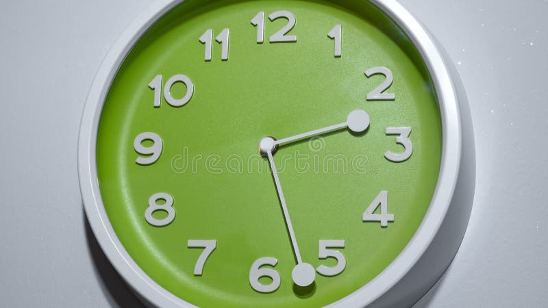 Timelapse of Analog Clock Face with Spinning Watch Hands on a Green ...