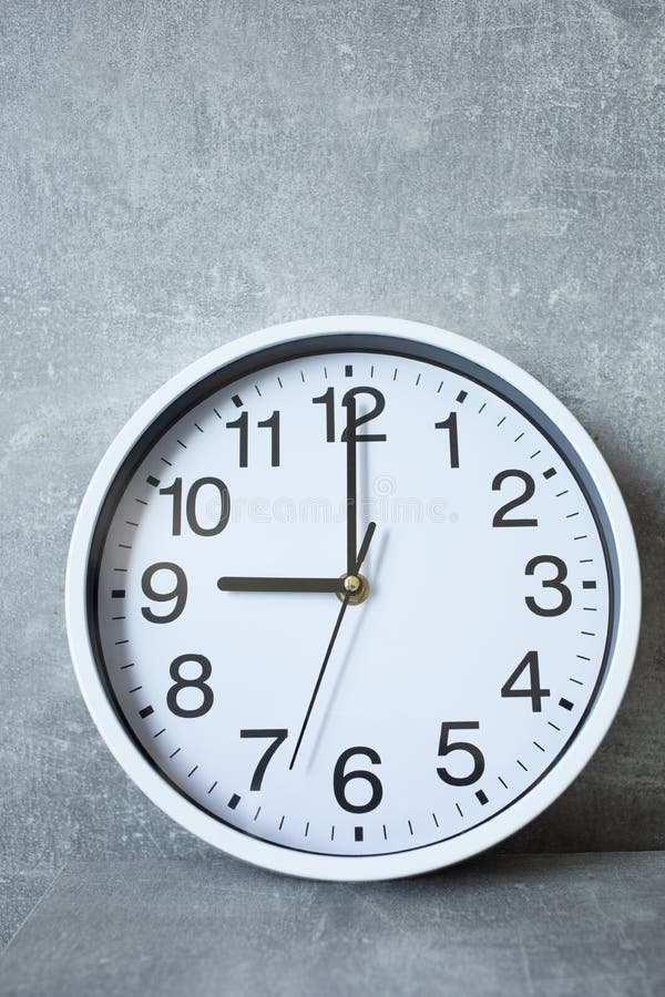 Wall Clock at Grey Shelf with Abstract Background Stock Photo - Image ...