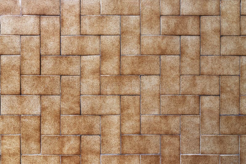 A Wall Covered in Small Rectangular Brown Tiles Stock Photo - Image of ...