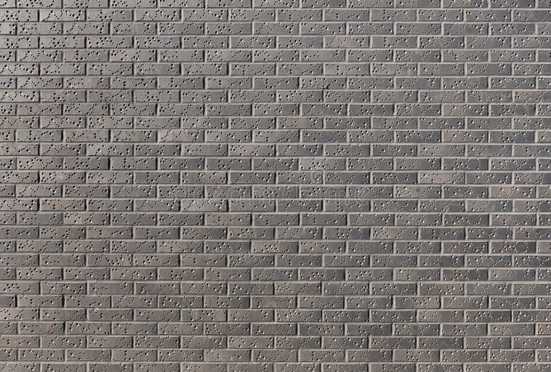Wall from a Dark Brick with a Pattern in a Bright Sunny Day As a Stock ...