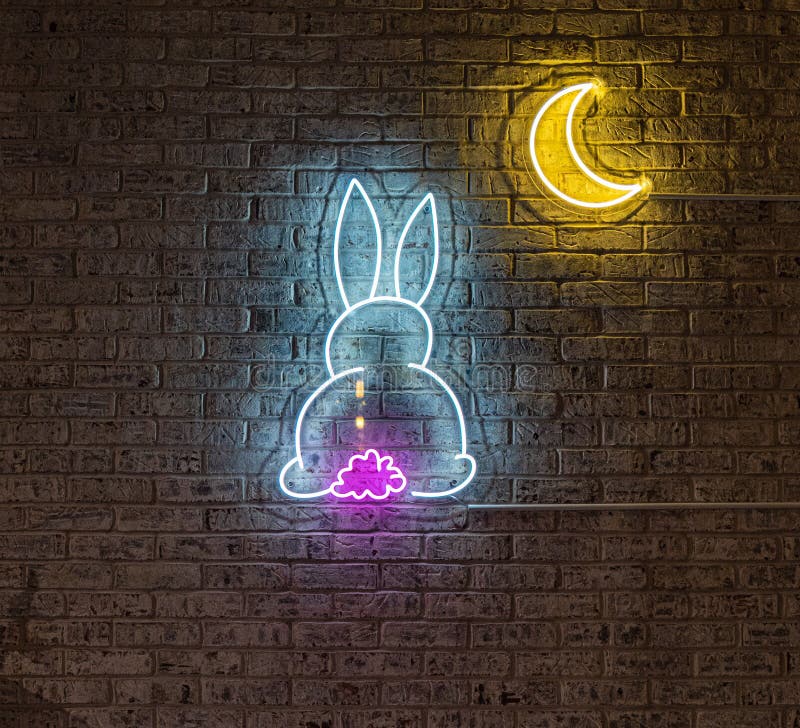 Wall Decorated with a Cute Rabbit Neon Sign with the Moon Stock Photo ...