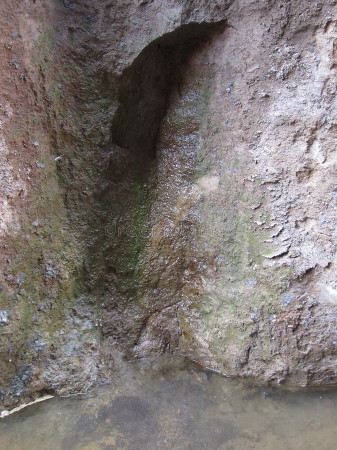 Sheer wall of deep pit stock photo. Image of blocks - 150457176