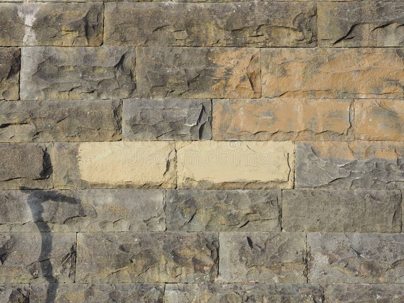 Wall with Embossed Rectangular Stone Tiles with a Rough Texture and ...