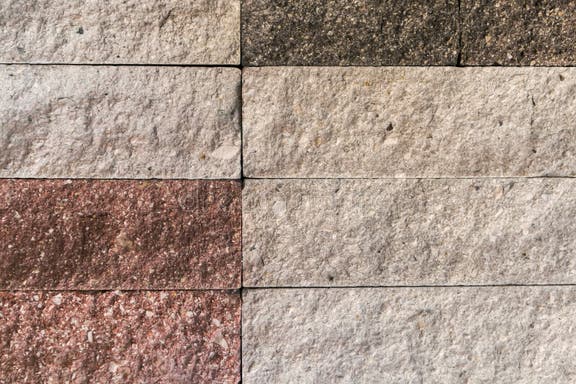 Wall Faced with Rough Rectangular Red and Gray Stone Tiles Stock Image ...