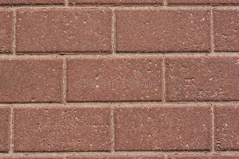 Wall of red granite bricks stock image. Image of face - 121676751