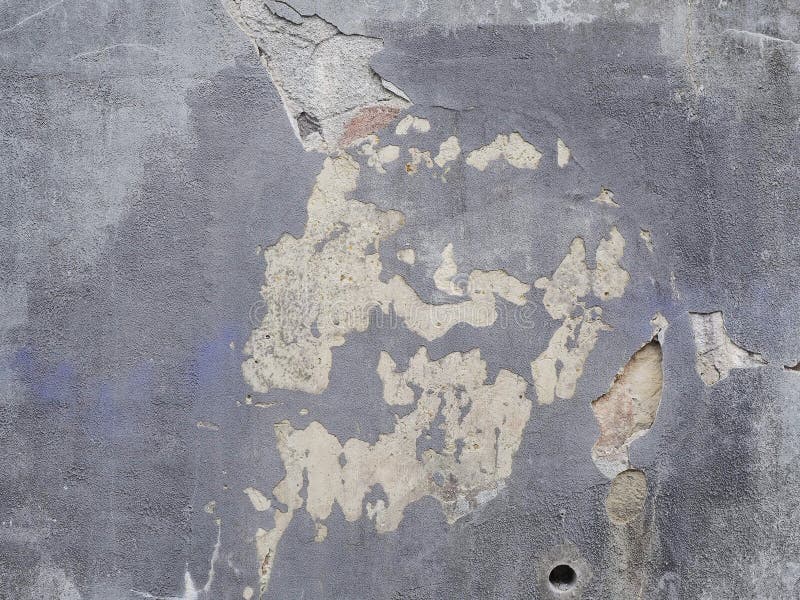 A Wall with Fallen Off Plaster in a Patchy Gray Color. Texture Stock ...