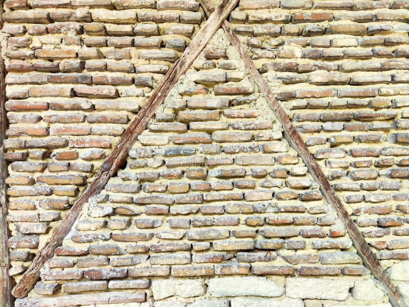 Wall Featuring a Unique Brick and Wood Design in a Rustic Setting Stock ...