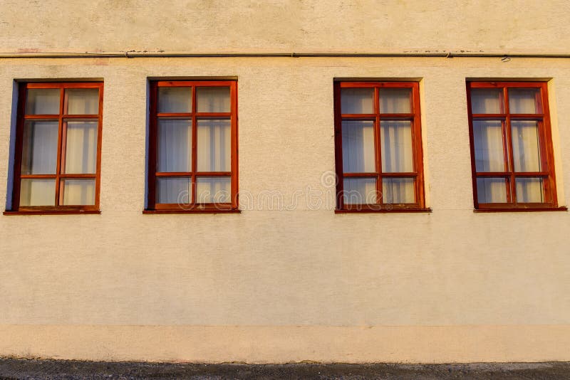 Wall with Four Wooden Windows Stock Image - Image of rural, facade ...