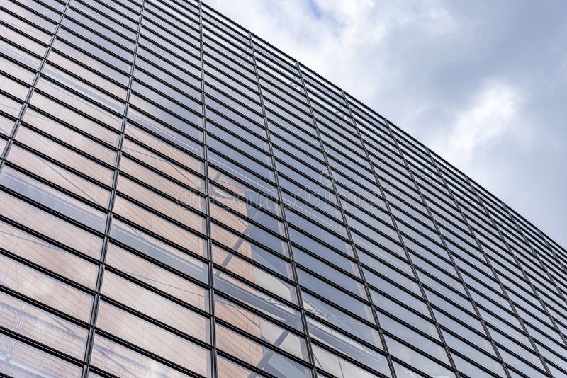 The Wall of Glass Windows of a Building. Stock Photo - Image of ...