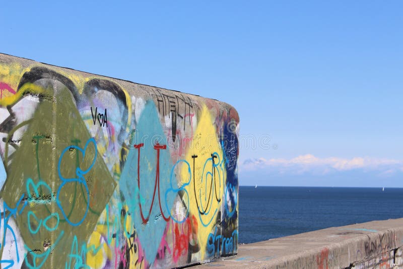 Wall with Graffiti and the Sea. Stock Image - Image of concrete ...