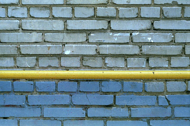 Wall of Grey Bricks with.Tube. Stock Image - Image of background, layer ...