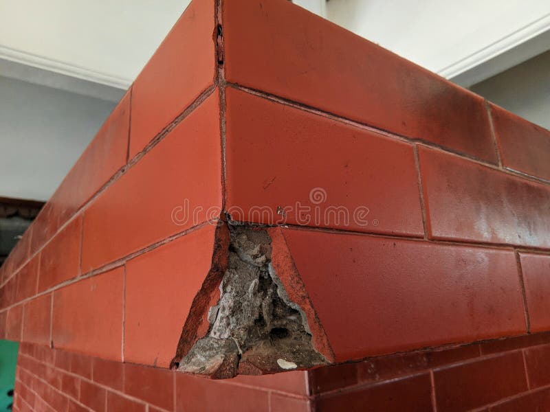 The Wall Has a Maroon Brick Pattern Whose Bottom Part is Broken so that ...