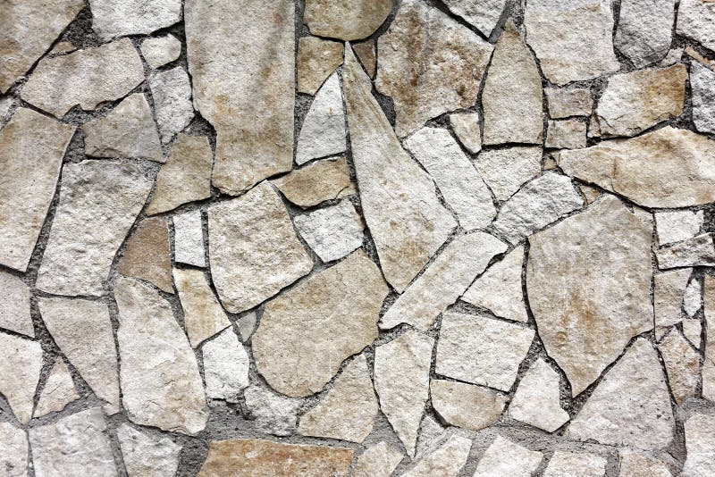 Wall of Irregular Shaped Stones Stock Photo - Image of irregular, stone ...
