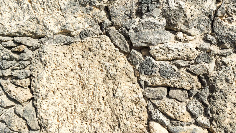 Wall of grey lava stone stock photo. Image of volcanic - 150453770