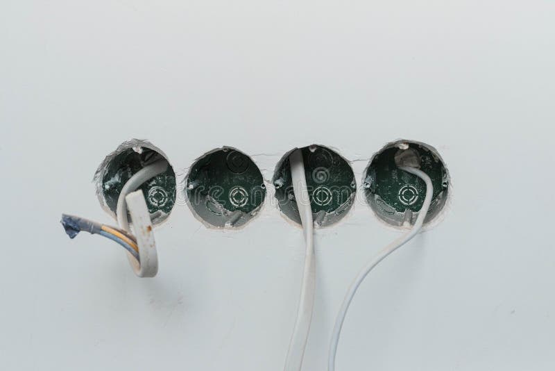 Wall is of Light-colored Plaster and Has Several Outlets. Professional ...