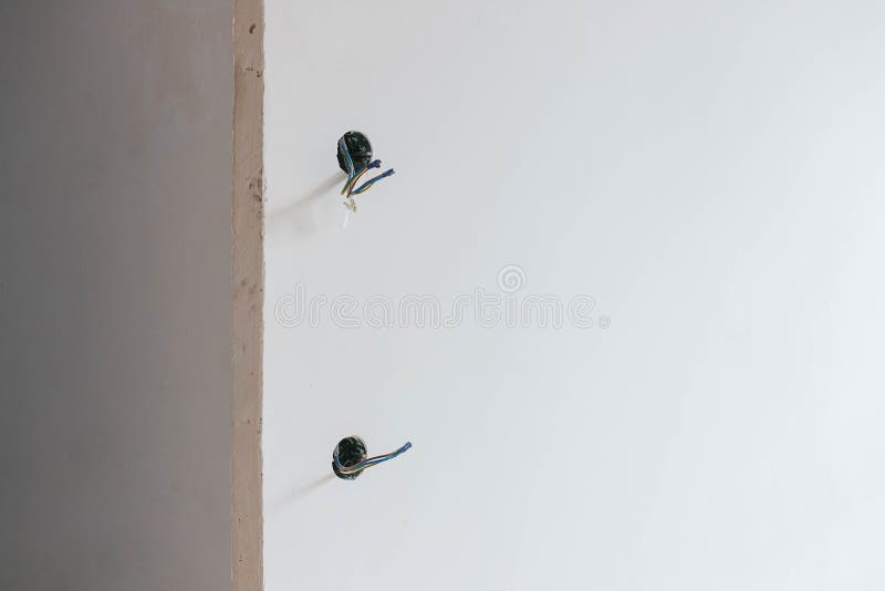 Wall is of Light-colored Plaster and Has Several Outlets. Professional ...