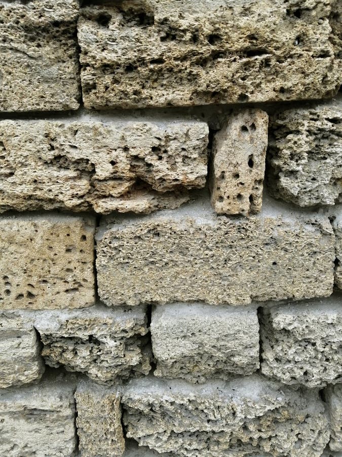 The Wall is Lined with Large Shell Rock Bricks. Old Building Materials ...