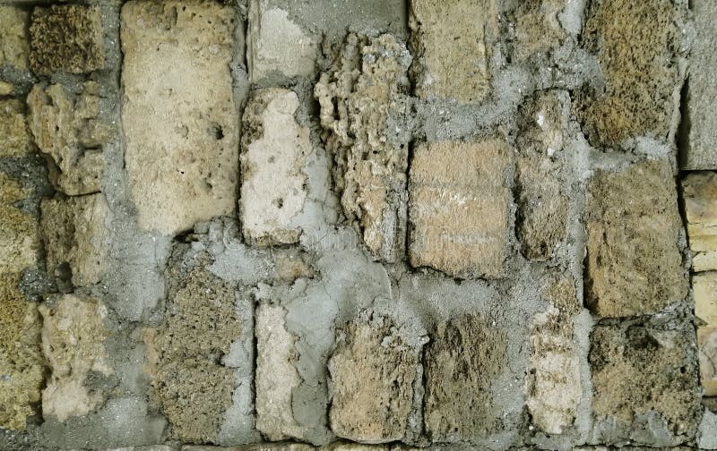 The Wall is Lined with Large Shell Rock Bricks. Old Building Materials ...
