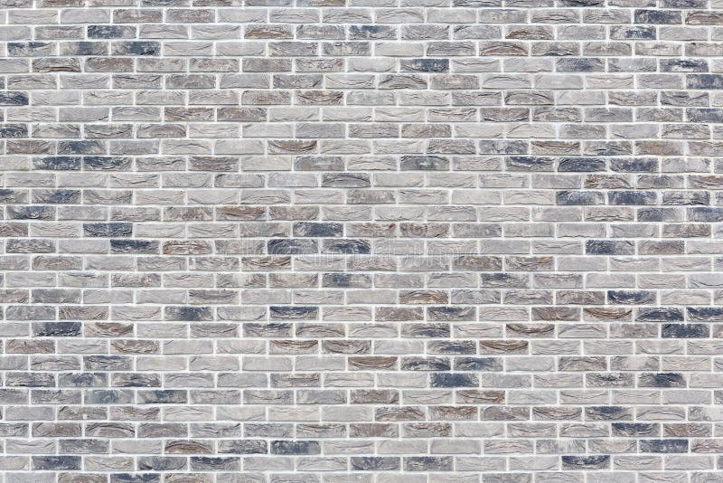 The Wall is Made of Beige and Gray Decorative Ceramic Bricks or Tiles ...