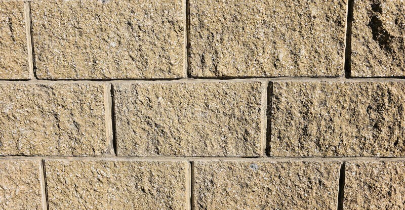 The Wall is Made of Decorative Rectangular Light Brown Stone. Stone ...