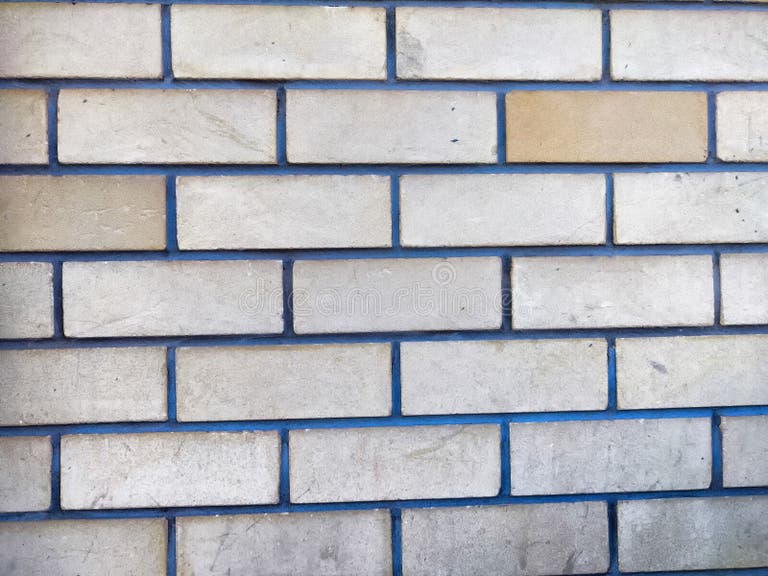 Wall Made of Light-colored Bricks with Blue Mortar in Natural Light ...