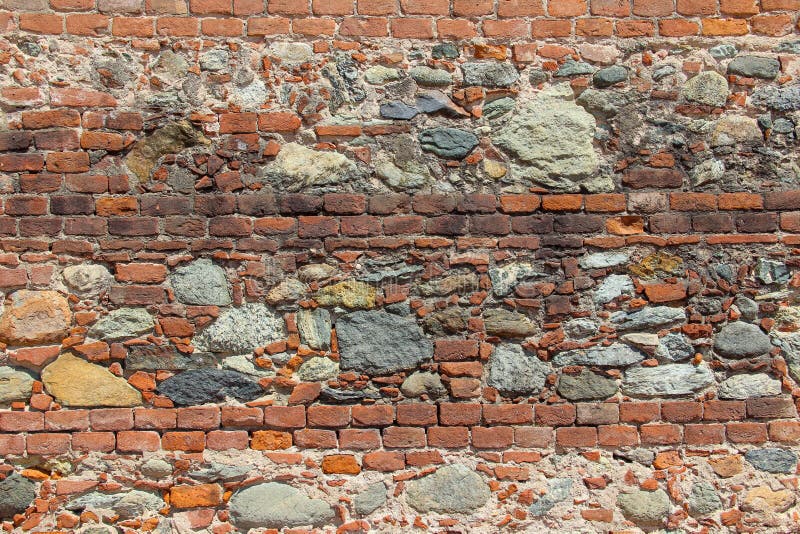 Wall Made of Natural Rocks, Bricks and Scrap Bricks Stock Photo - Image ...